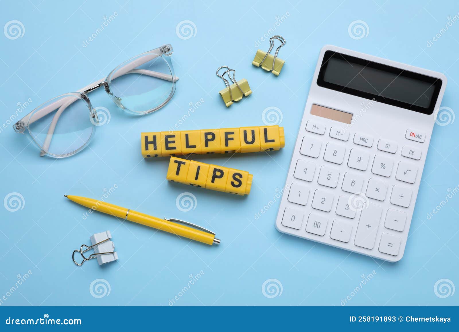 Flat Lay Composition with Phrase Helpful Tips Made of Yellow Cubes on ...