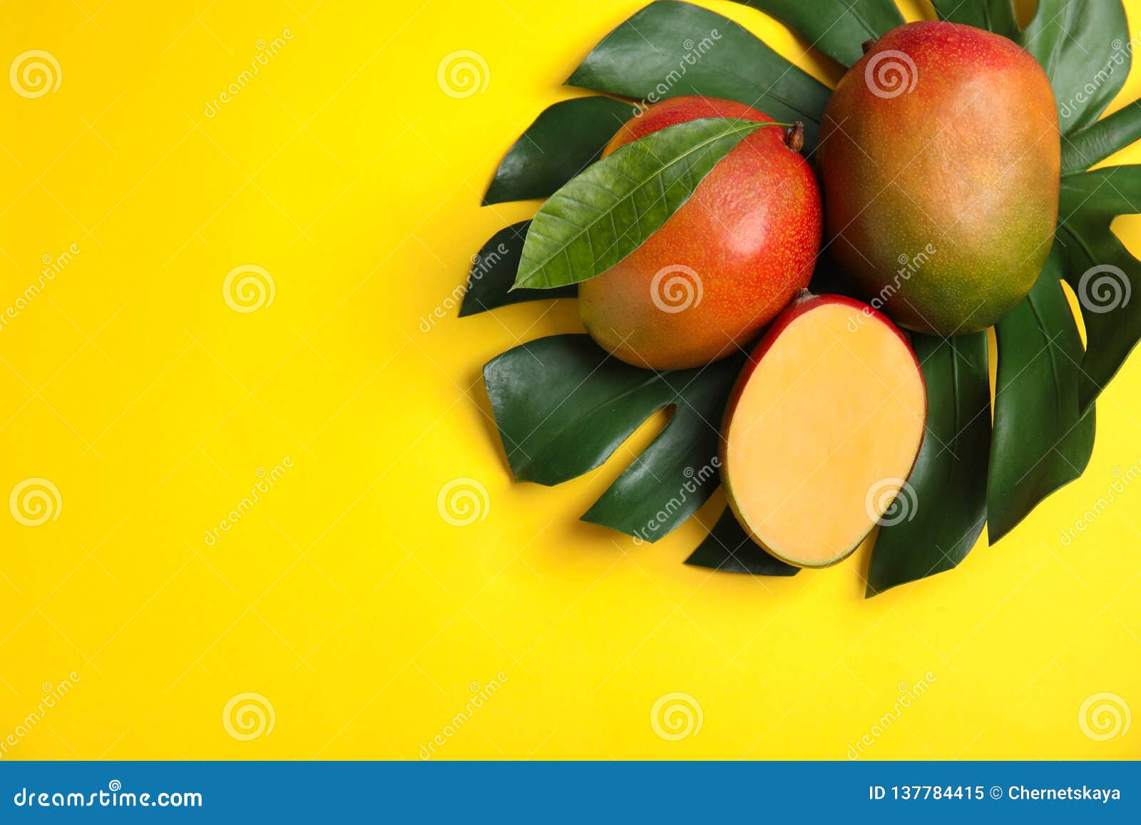 Flat Lay Composition with Ripe Mangoes, Monstera Leaf and Space for ...