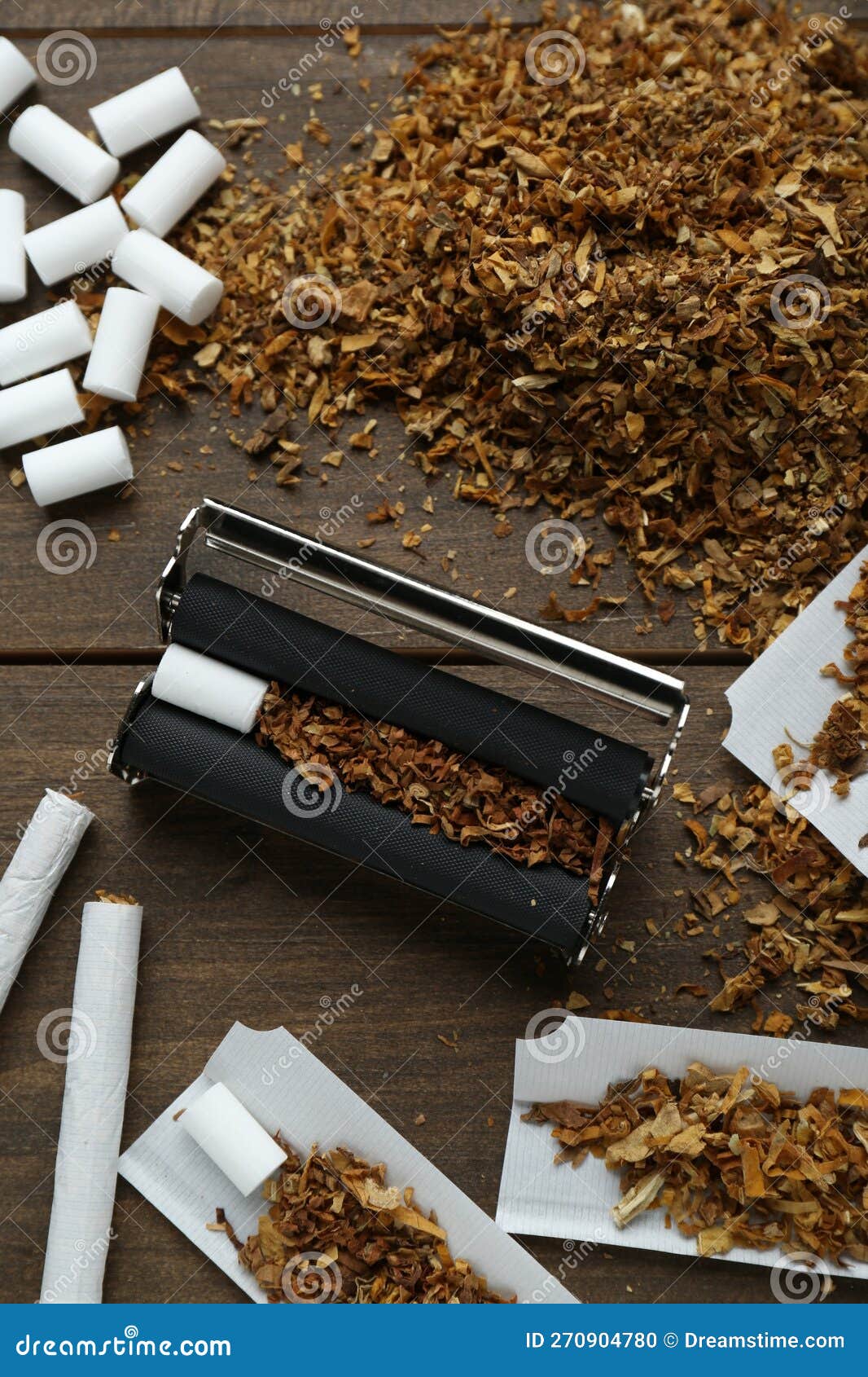 Flat Lay Composition with Roller and Tobacco on Wooden Table. Making ...
