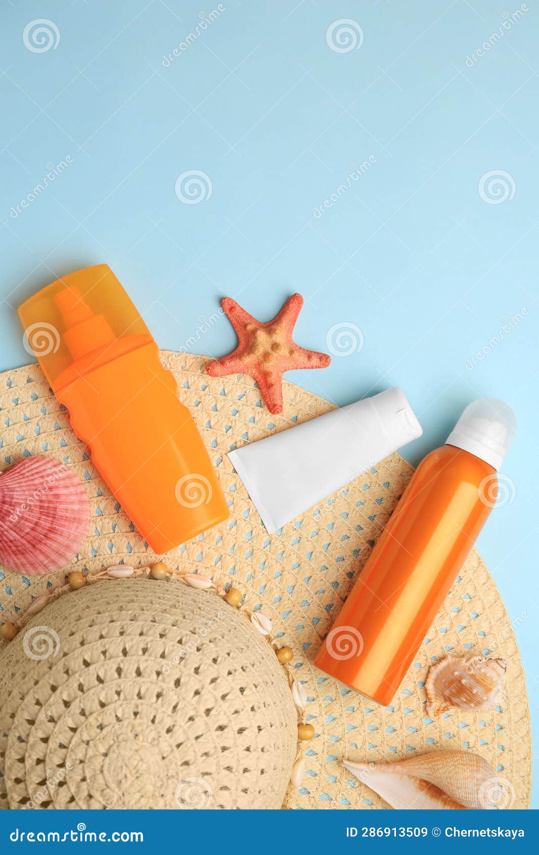 Flat Lay Composition with Sunscreen on Light Blue Background. Sun ...