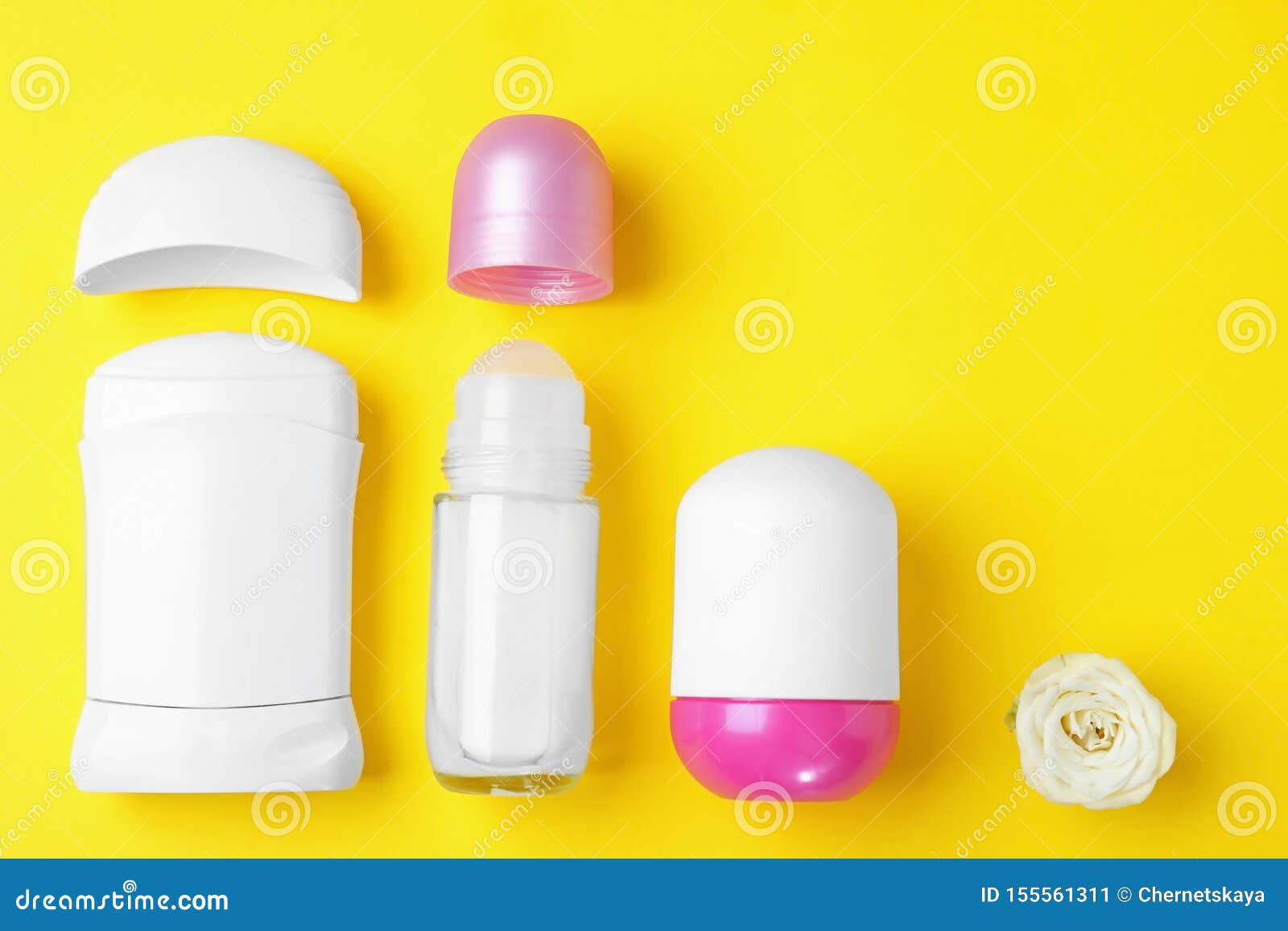 Flat Lay with Different Female Deodorants on Yellow Background, Space ...