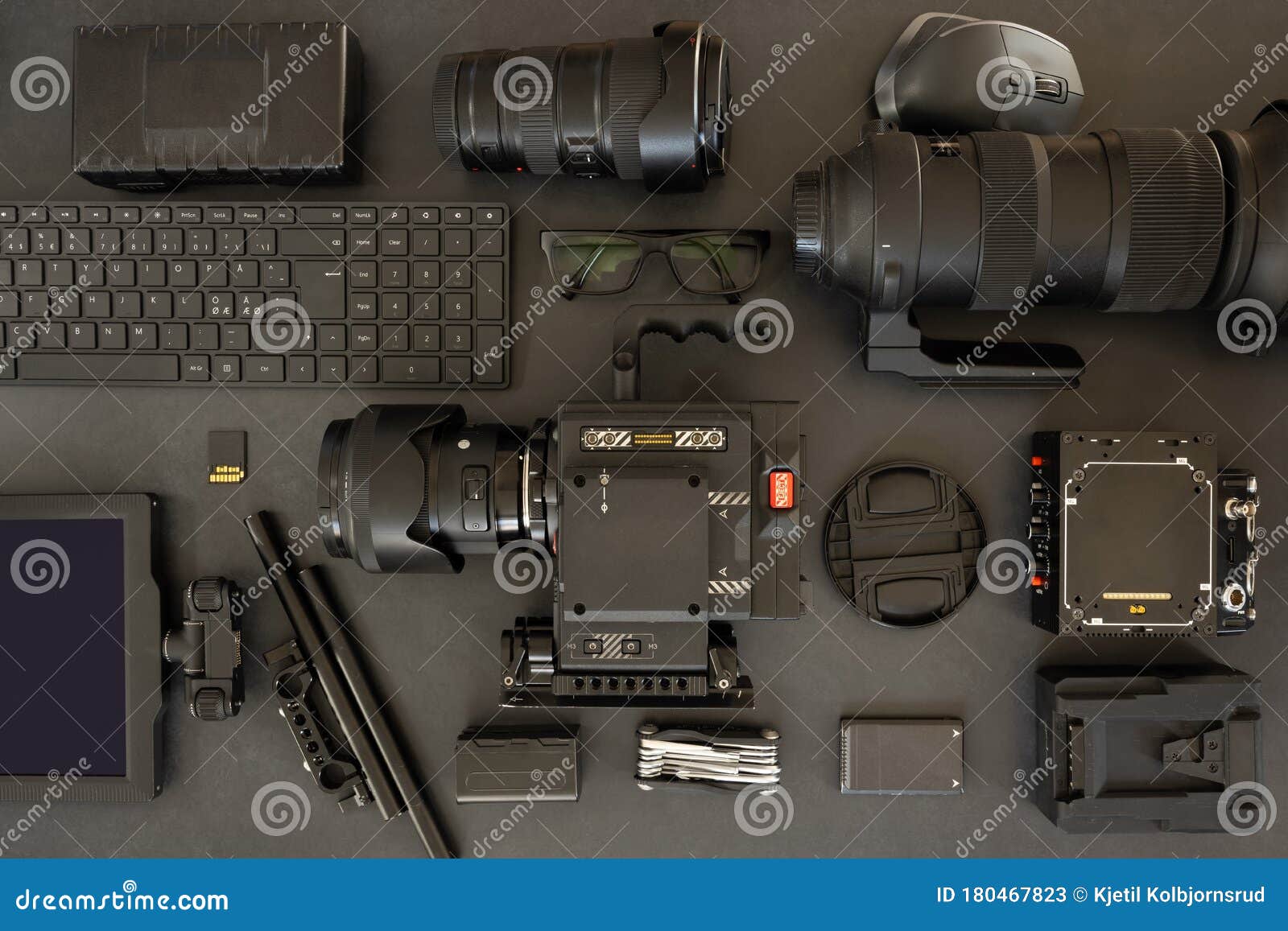Flat Lay of Filming Equipment with Keyboard and Eyeglasses on Table ...