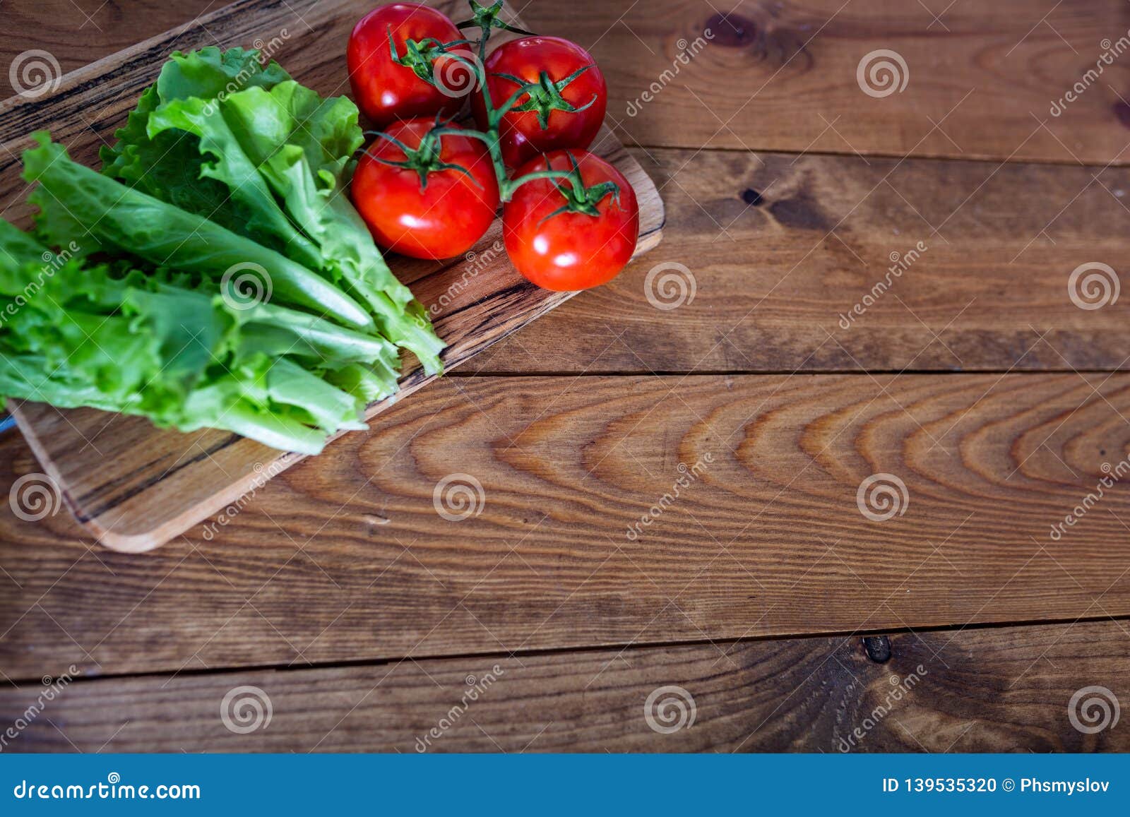 Flat Lay. Kitchen Table with Lettuce and Red Tomatoes Stock Photo ...