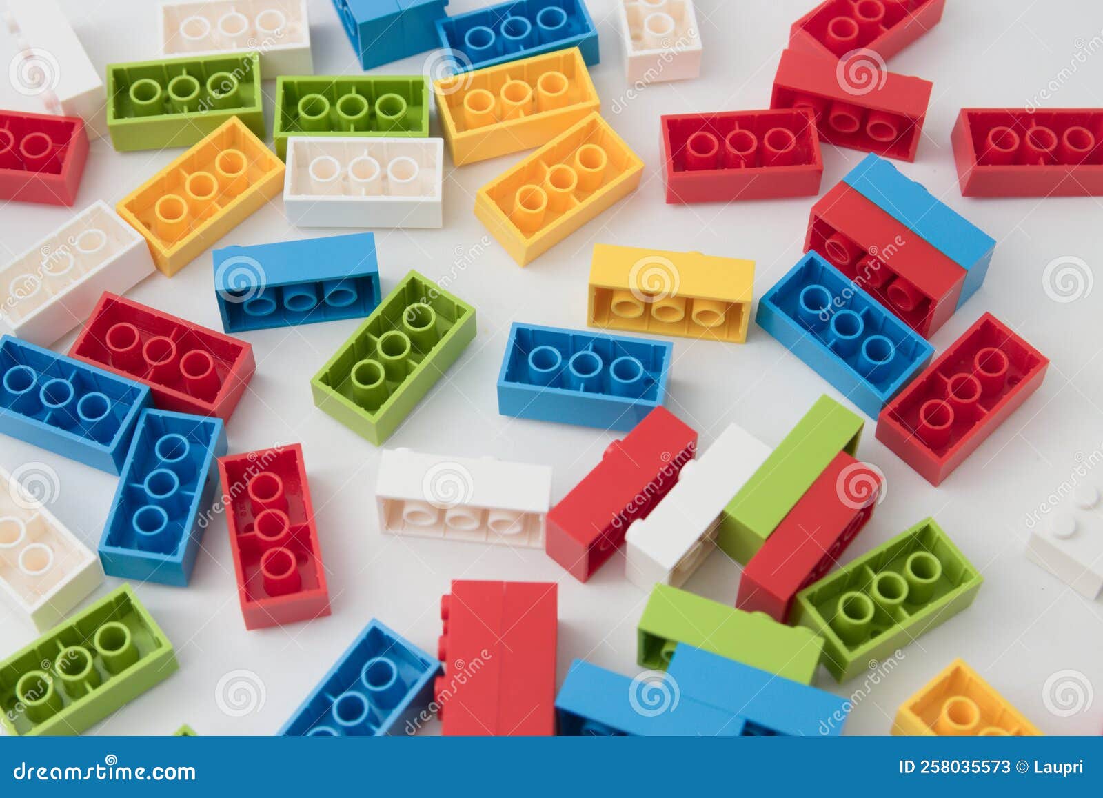Flat Lay of Many Assorted Colored Plastic Building Blocks on a White ...