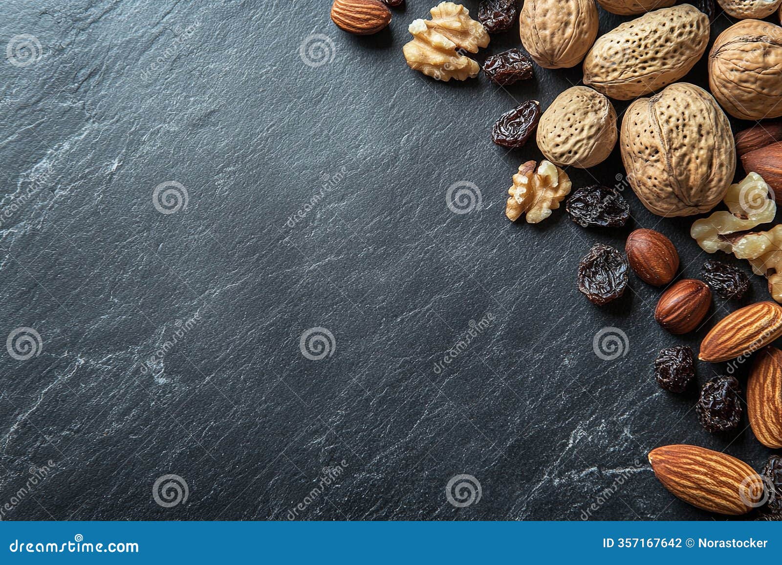 A Flat Lay of Nuts and Dried Fruits Styled on a Smooth Stone Surface ...