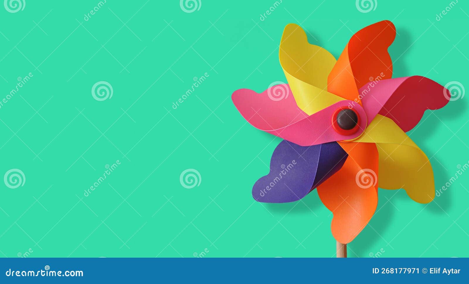 Flat Lay Rainbow Pinwheel on Green Background, Copy Space Stock Image ...