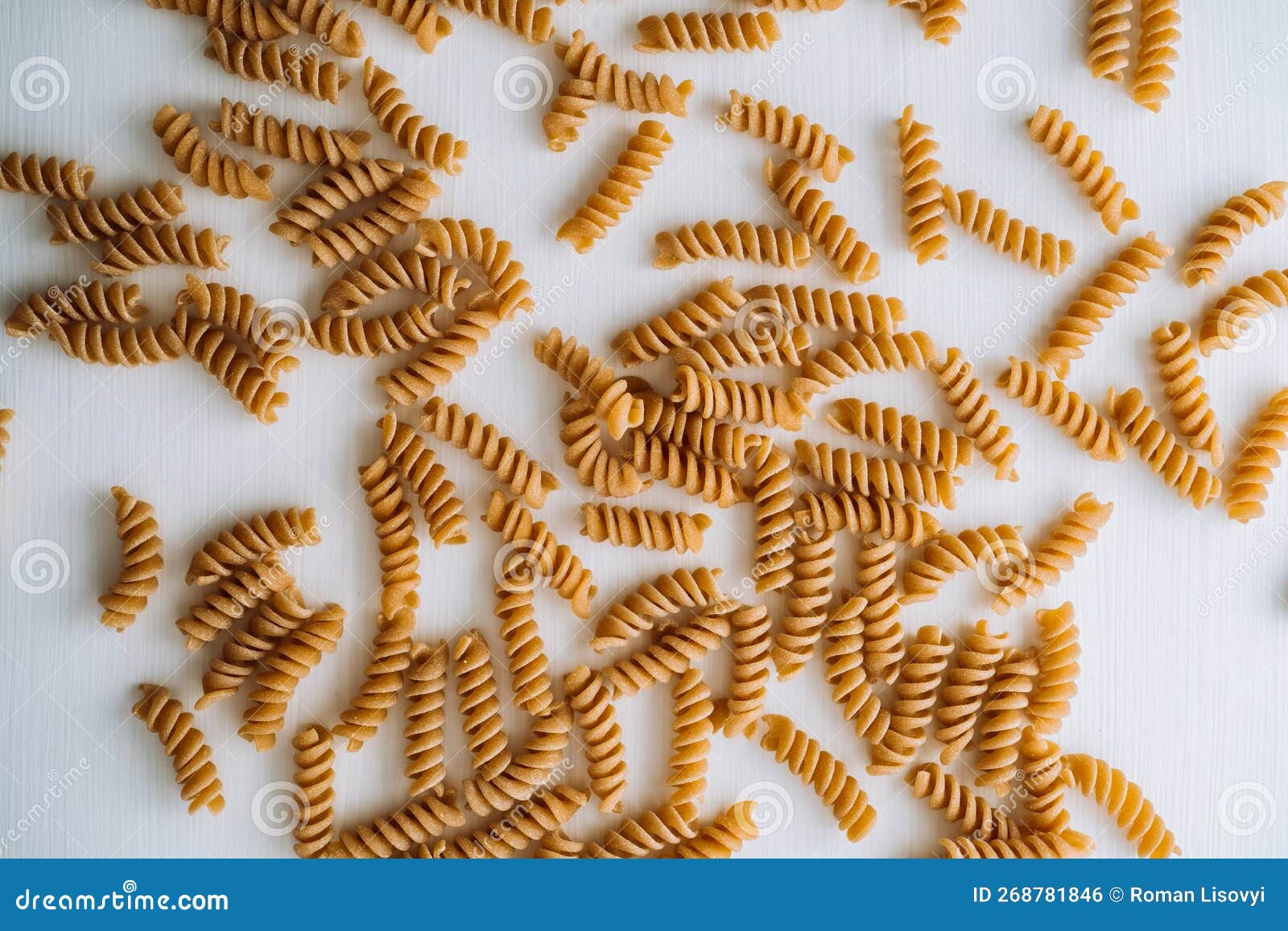 Flat Lay of Scattered Many Wavy Pasta from Whole Wheat Flour on White ...