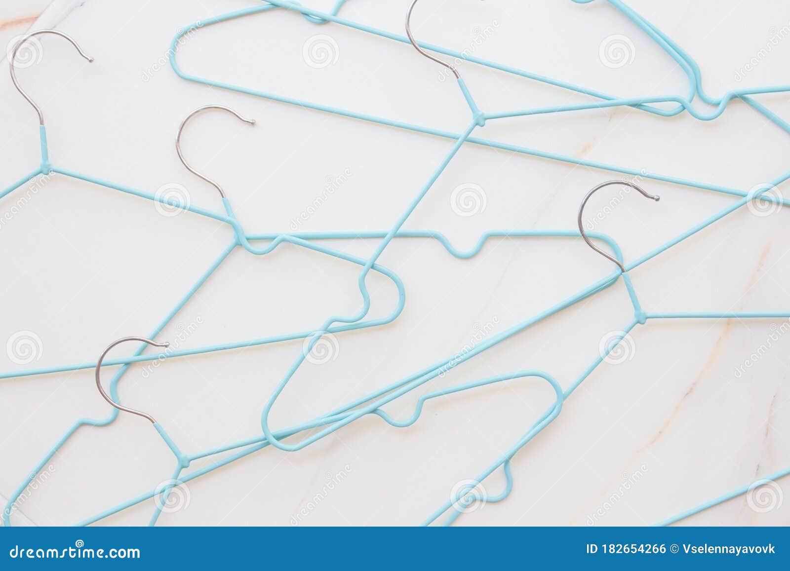 Flat Lay Set of Blue Hangers on White Marble. Many Colored Hangers ...