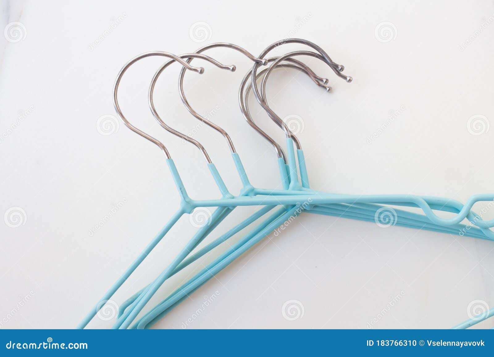 Flat Lay Set of Blue Hangers on White Marble. Many Colored Hangers ...
