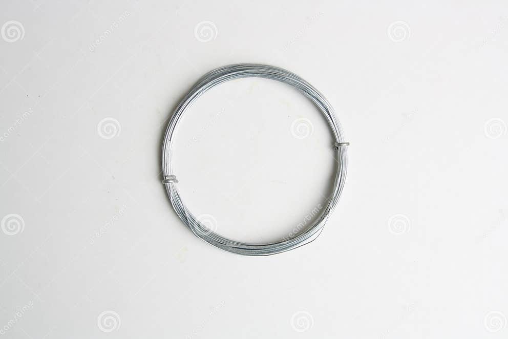 Flat Lay Shot of a Metal Wire Roll on a White Surface Stock Image ...