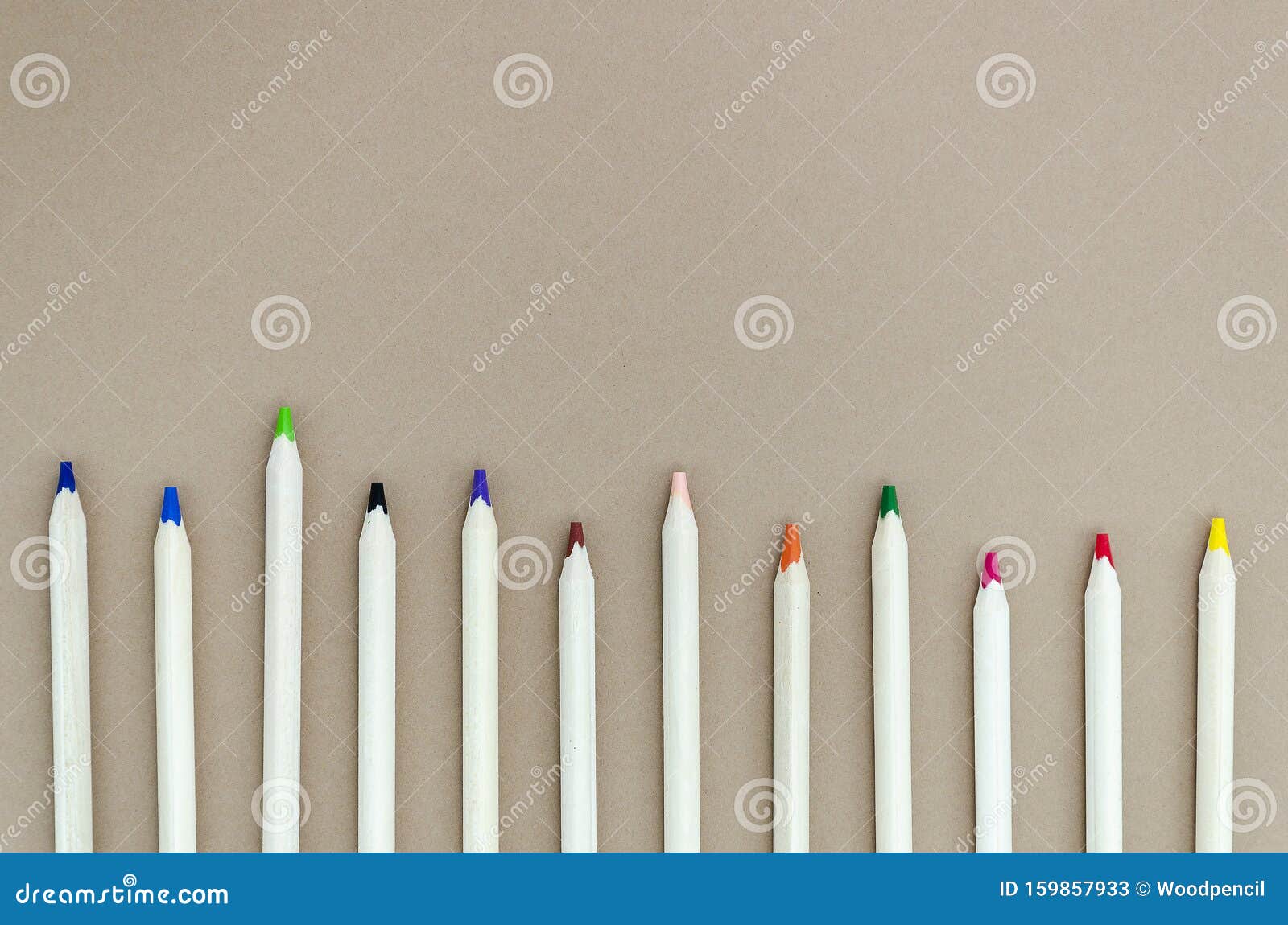 Flat Lay Spectrum of Color Pencils with Copyspace on a Craft Background ...