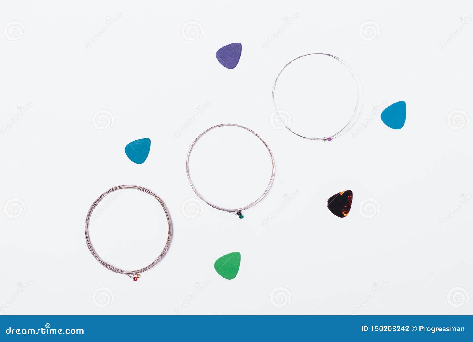 Flat Lay Steel Guitar Strings and Plastic Picks Stock Photo - Image of ...