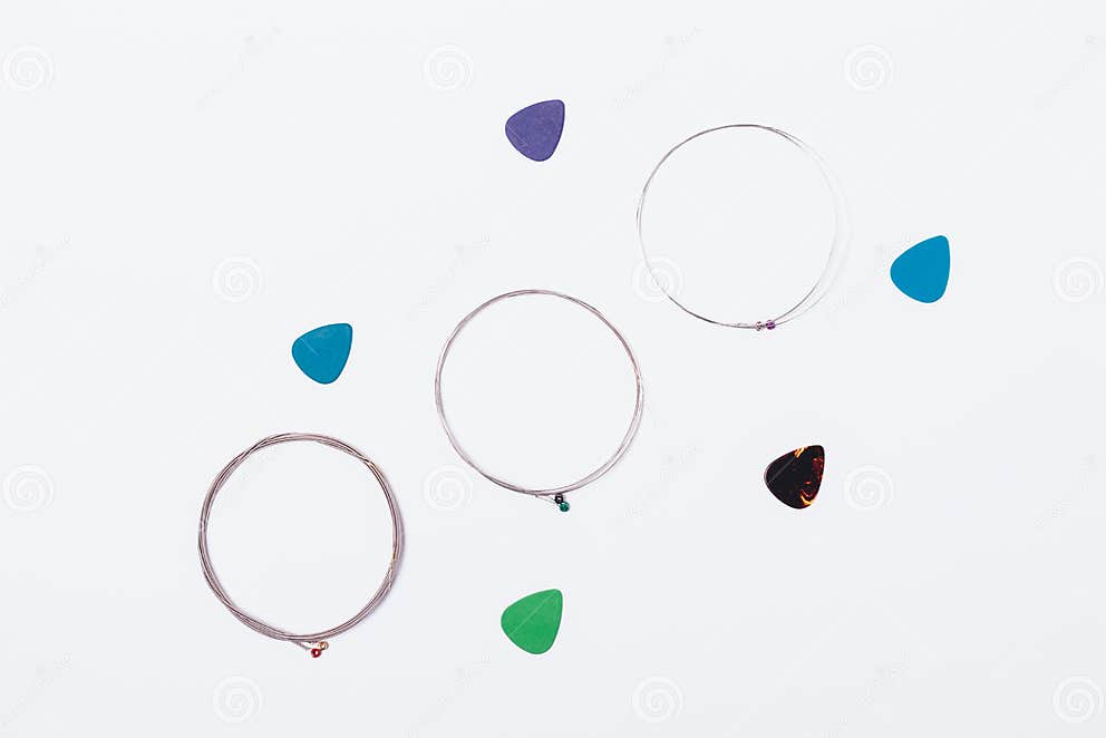 Flat Lay Steel Guitar Strings and Plastic Picks Stock Photo - Image of ...