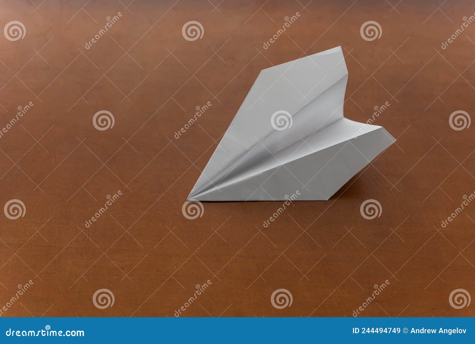 Flat Lay of White Paper Plane on Pastel Brown Background. Stock Image ...