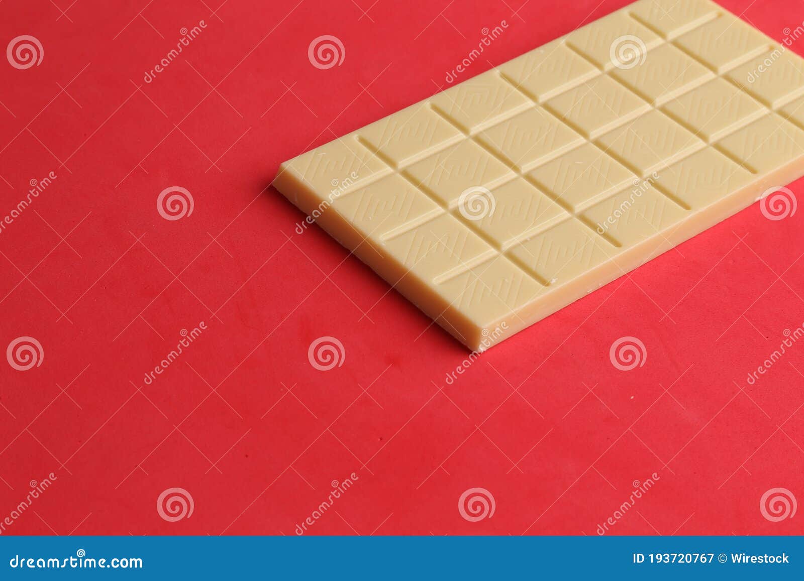Flat Long Bar of White Chocolate on a Red Surface Stock Image - Image ...