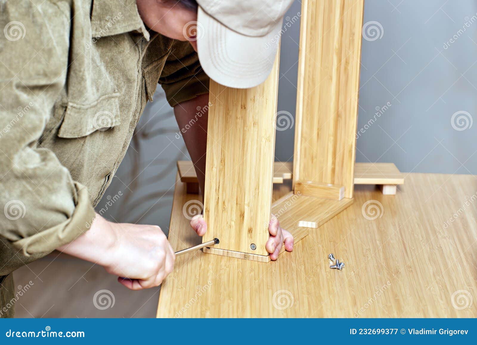 Flat Pack Furniture Assembly By Handyman With Screwdriver Stock Image