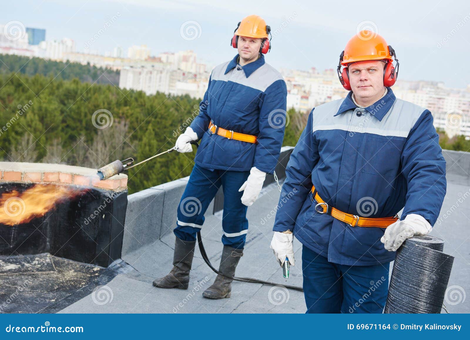 Flat Roof Workers with Bitumen Roofing Felt and Flame Torch Stock Photo ...