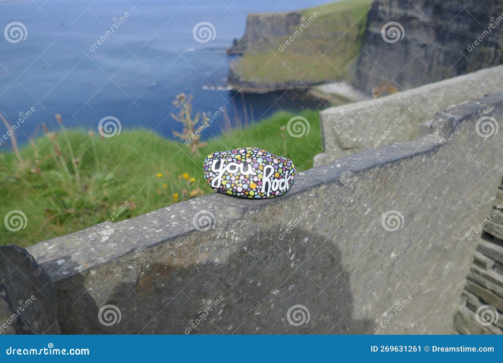 Flat Stone Wall with Kindness Rock on Top and Cliffs Out of Focus in ...