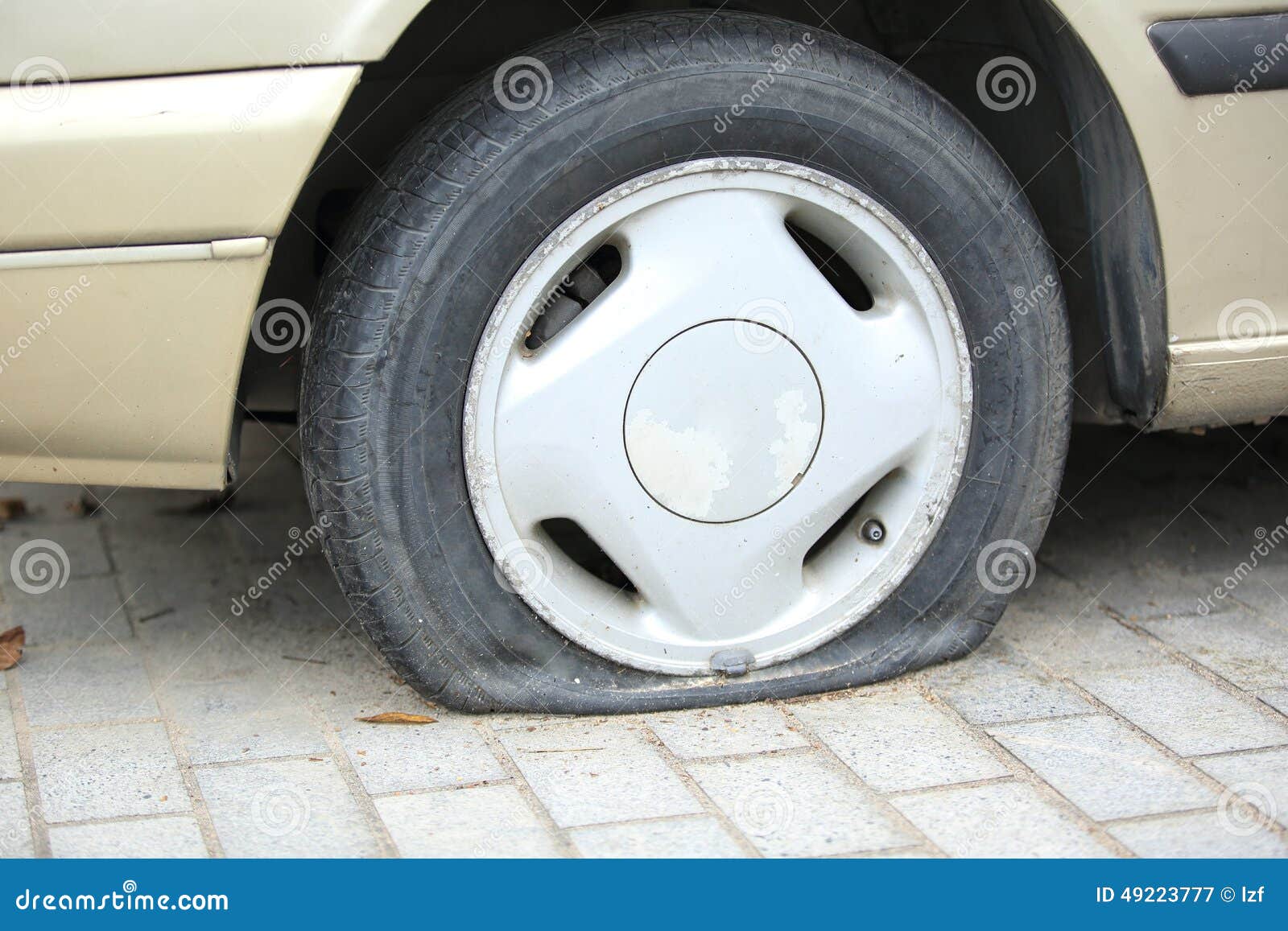 Flat tire on car wheel stock image. Image of collision - 49223777