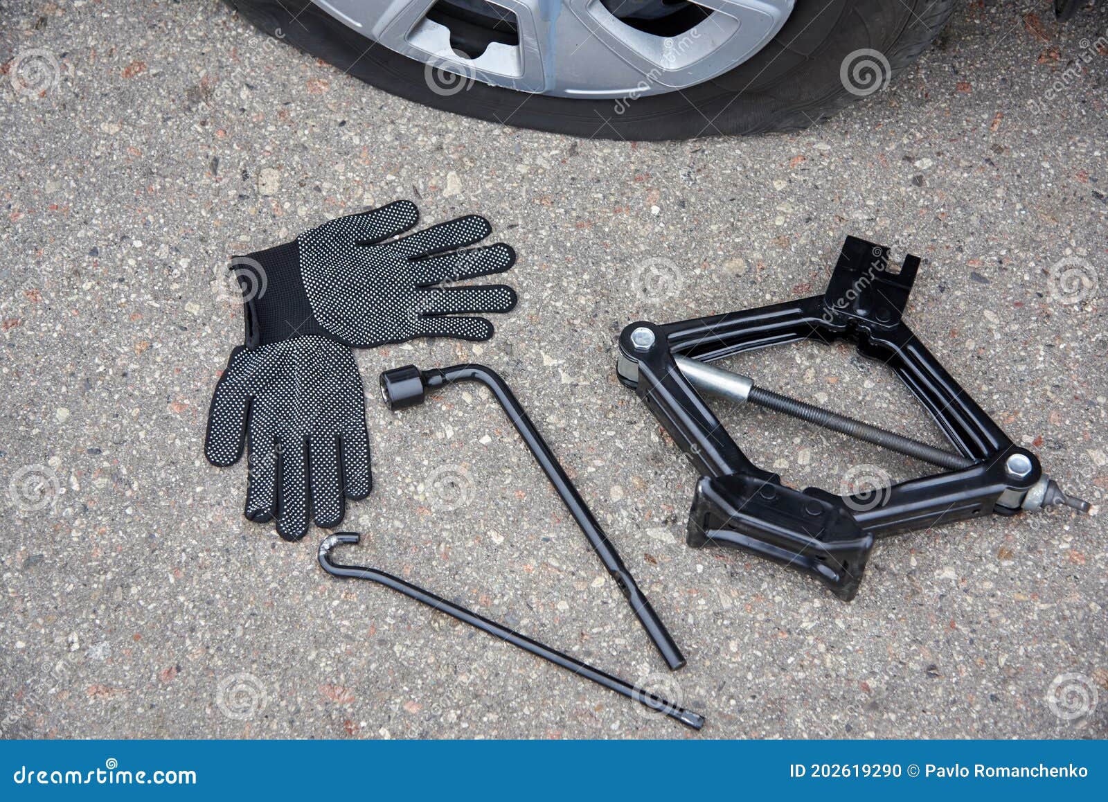 Flat Tire of a Car, Wheel Replacement Tools, Trouble on the Road Stock ...