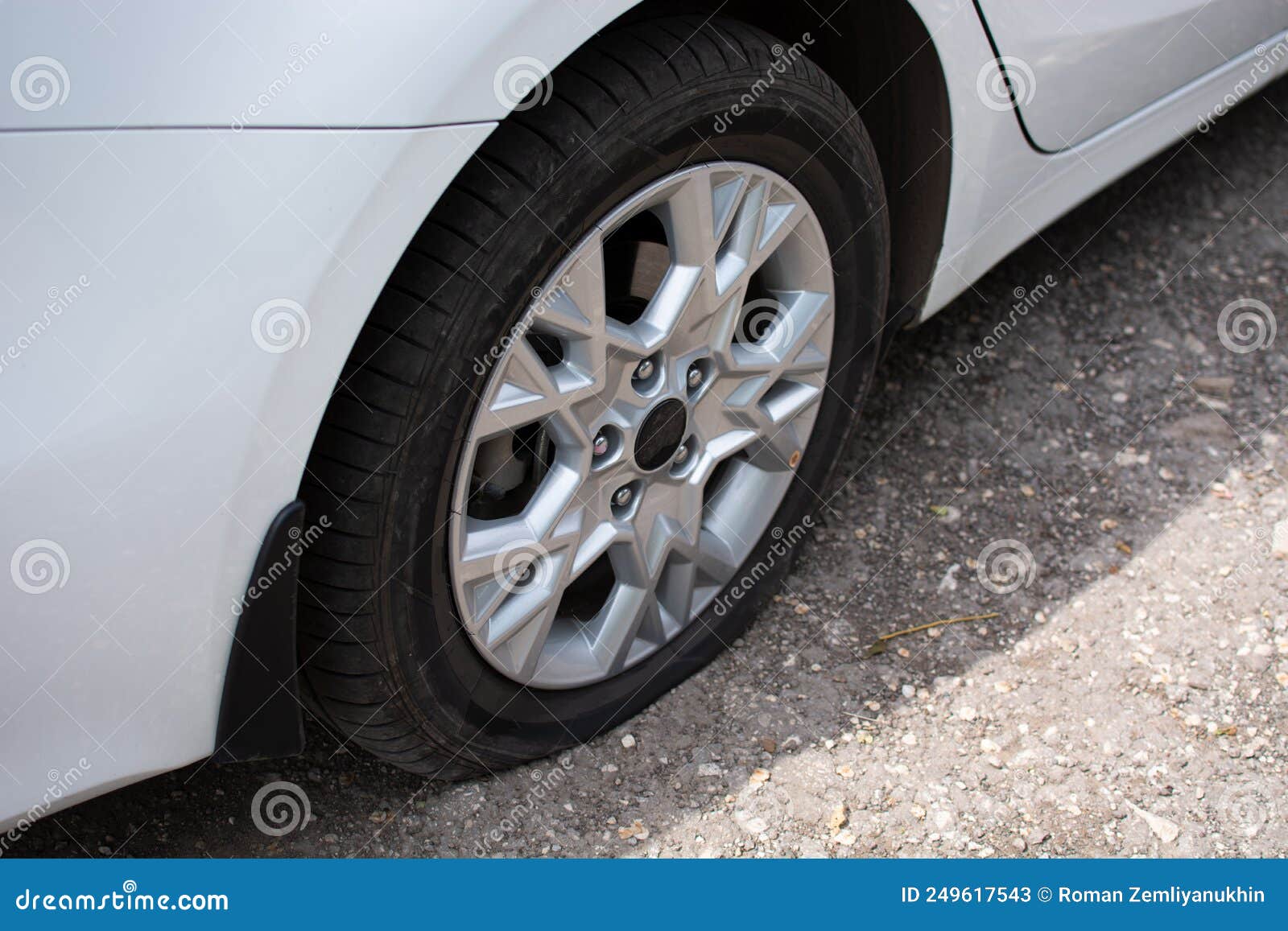 Flat tire on a white car stock image. Image of accident - 249617543