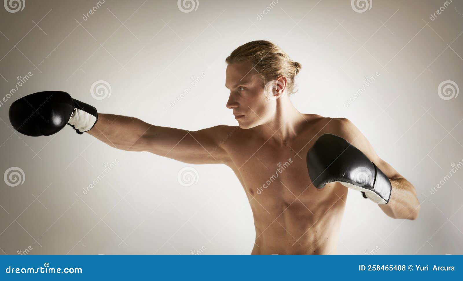 Flawless Boxing Technique. a Handsome Young Male Boxing Shirtless ...