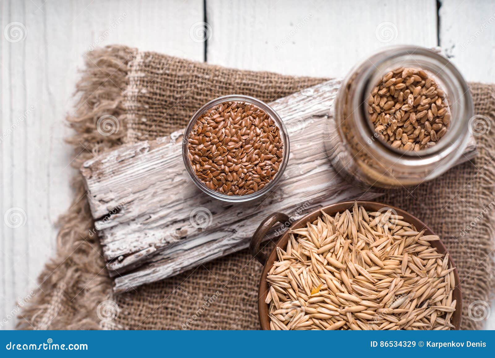 Flax, Oats, Wheat in Glass Jars on the Boards Top View Stock Image ...
