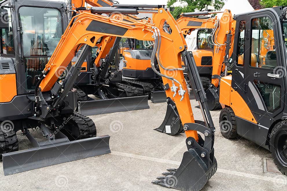 Fleet of Yellow Construction Machines Stock Image - Image of loader ...