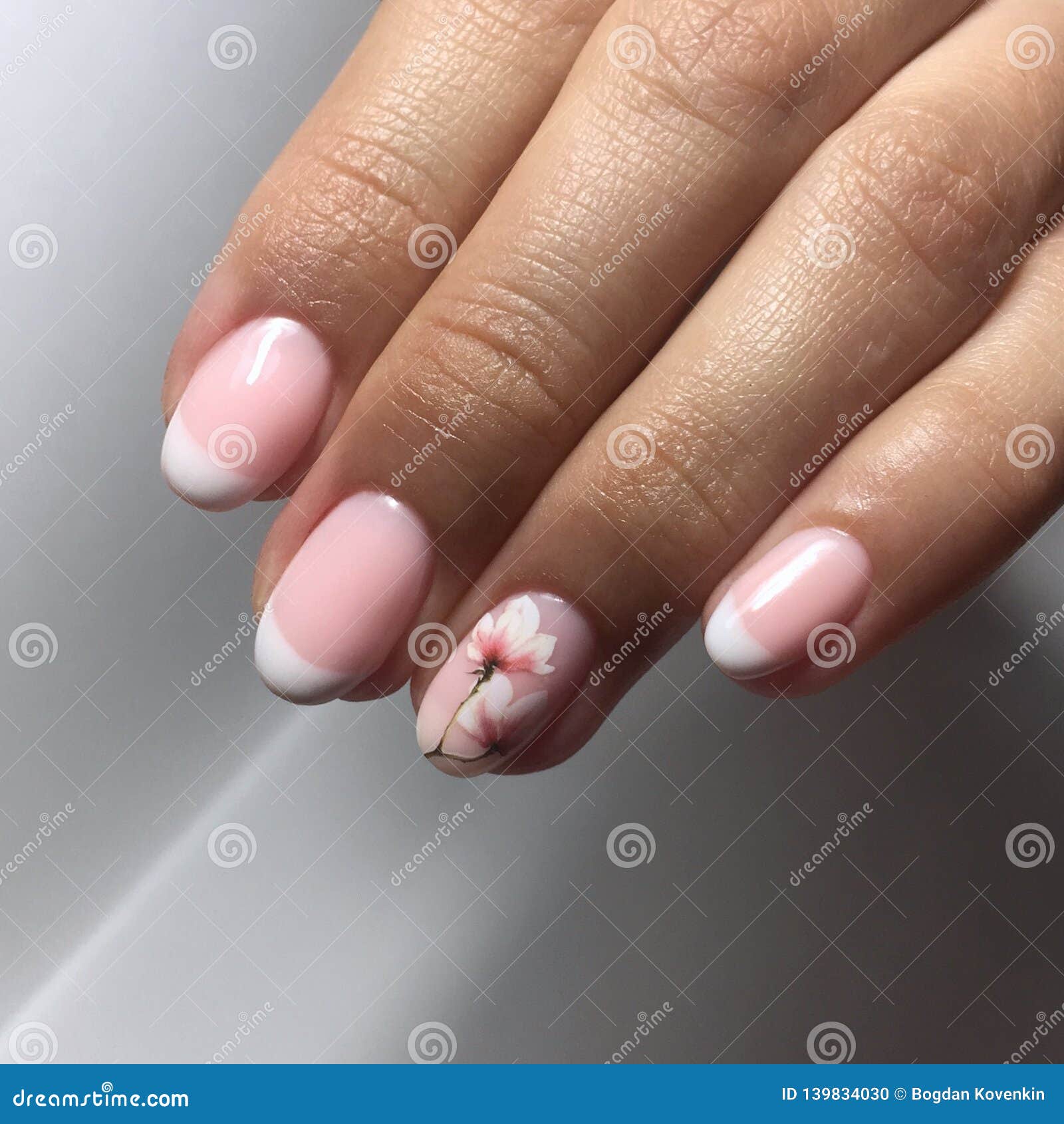 Flesh-colored Beautifull Manicure on Nails. Female Manicure Stock Photo ...