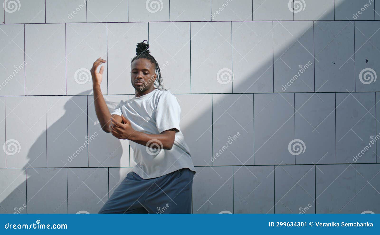 Flexible Dancer Practising Choreography at City Closeup. Guy Making ...