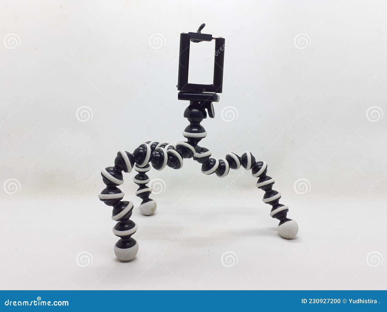 A Flexible Detachable Phone and Camera Stand on White Isolation ...