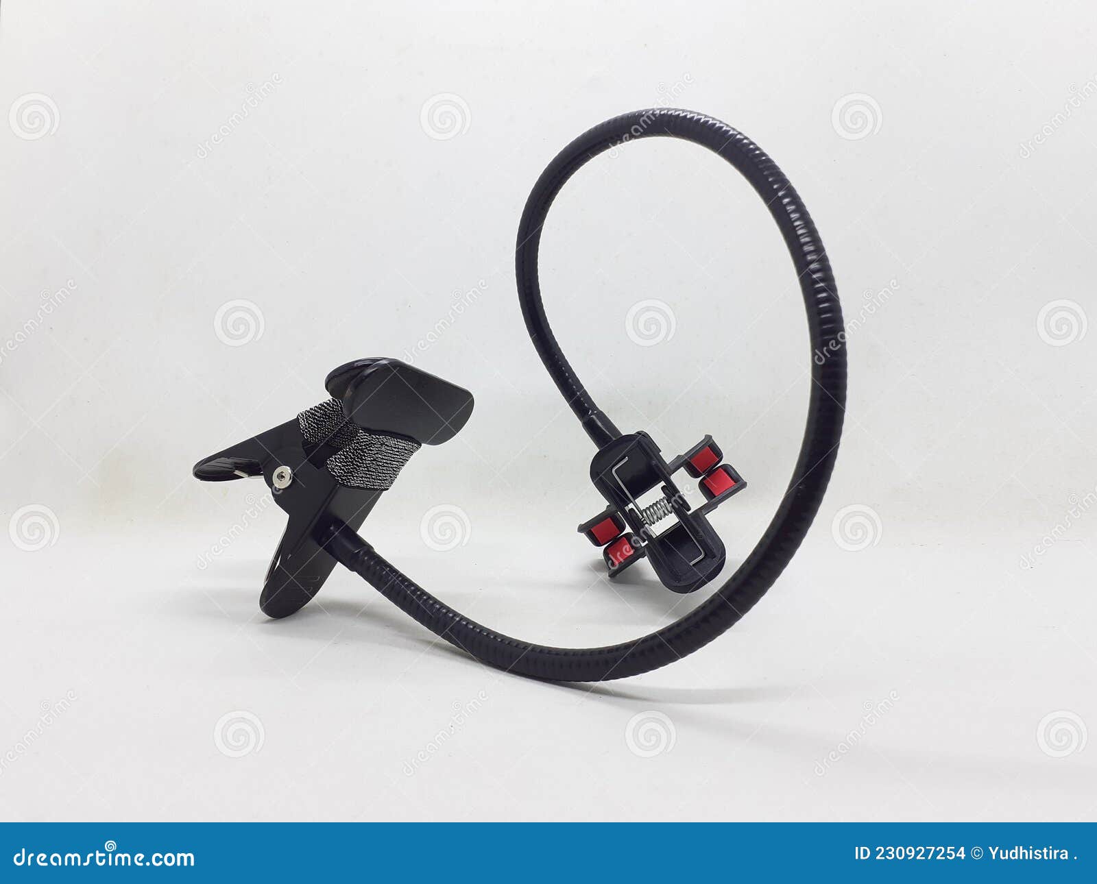 A Flexible Detachable Phone and Camera Stand on White Isolation ...