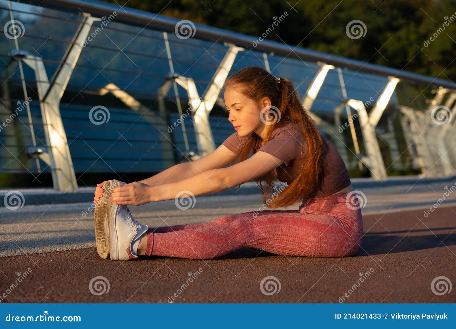 Flexible Ginger Woman Warms Up at the Bridge Stock Image - Image of ...