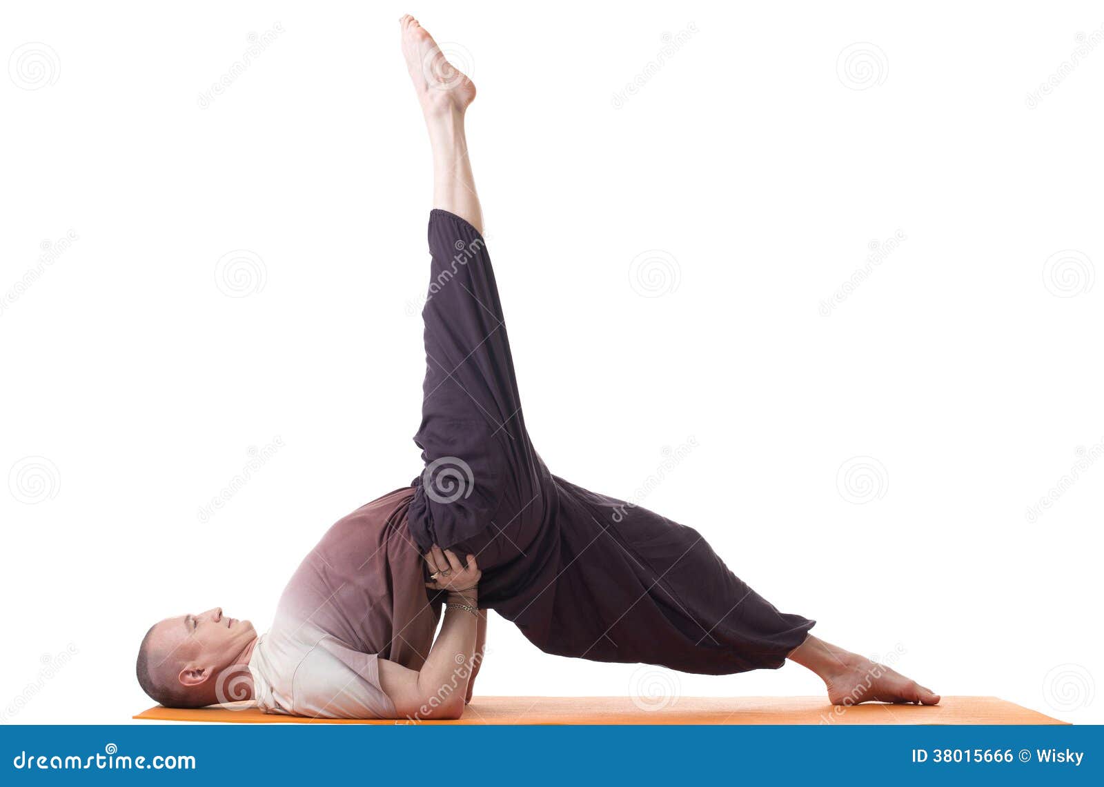 Flexible Man Practicing Yoga Exercises in Studio Stock Photo - Image of ...