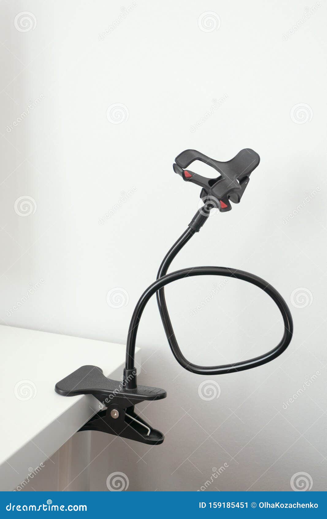 Flexible Mobile Phone Holder on Wall Background. Multipurpose Mobile ...