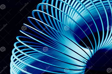 Blue Flexible Slinky Spring Editorial Photography - Image of abstract ...