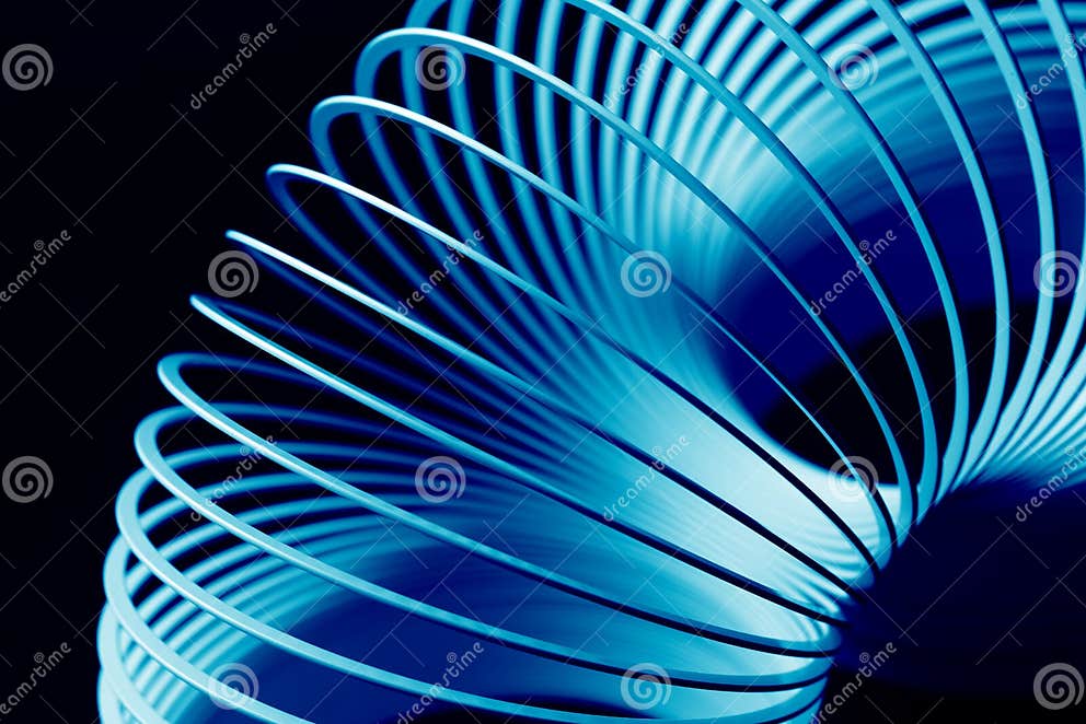 Blue Flexible Slinky Spring Editorial Photography - Image of abstract ...