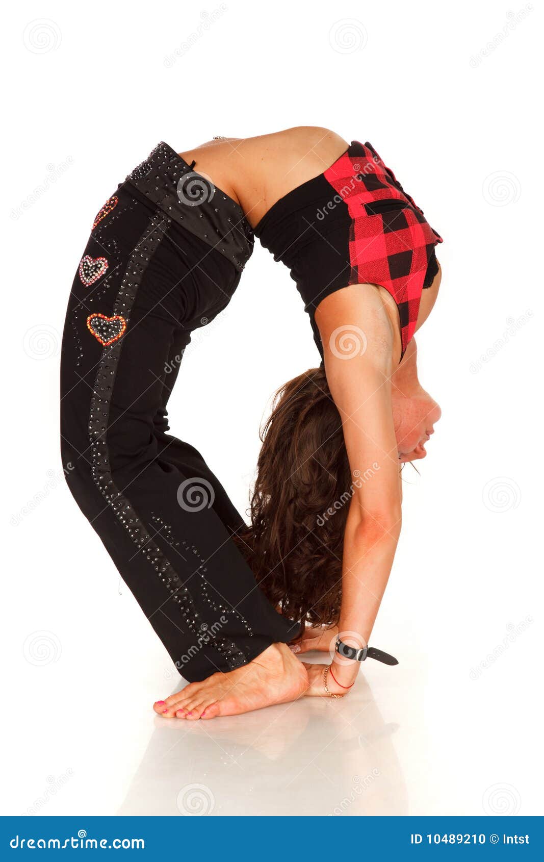 Flexible Woman Bends, Stretching Body During Yoga Royalty-Free Stock ...