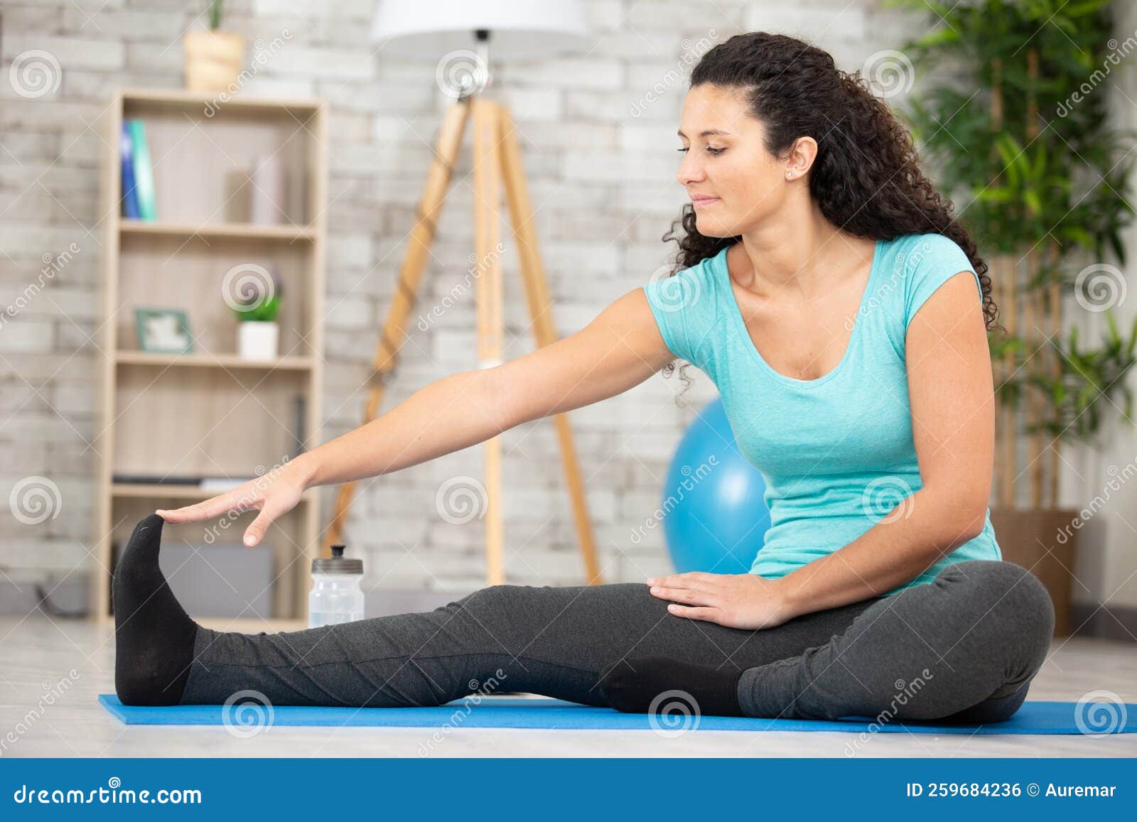 Flexible Woman Reaching Toes during Stretching Exercise Stock Photo ...