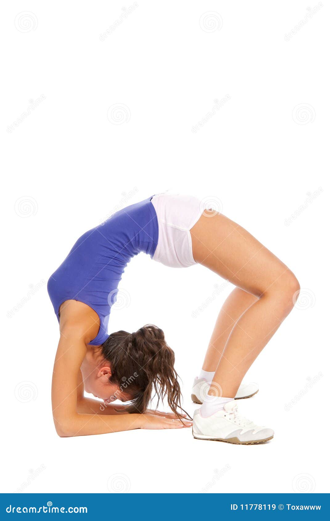 Flexible Woman Bends, Stretching Body During Yoga Royalty-Free Stock ...