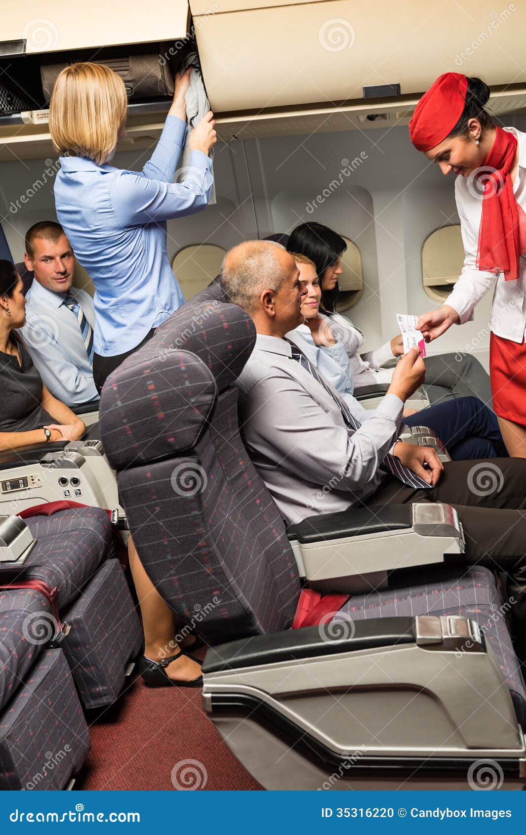 Flight Attendant Check Passenger Tickets Cabin Stock Photo - Image of ...