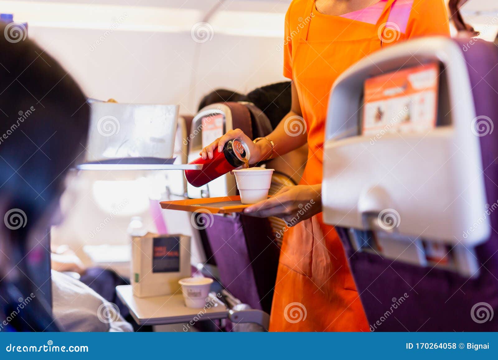Flight Attendant Serving Drinks To Passengers on Board. Stock Photo ... Flight Attendant Serving Drinks To Passengers on Board. Stock Photo ...