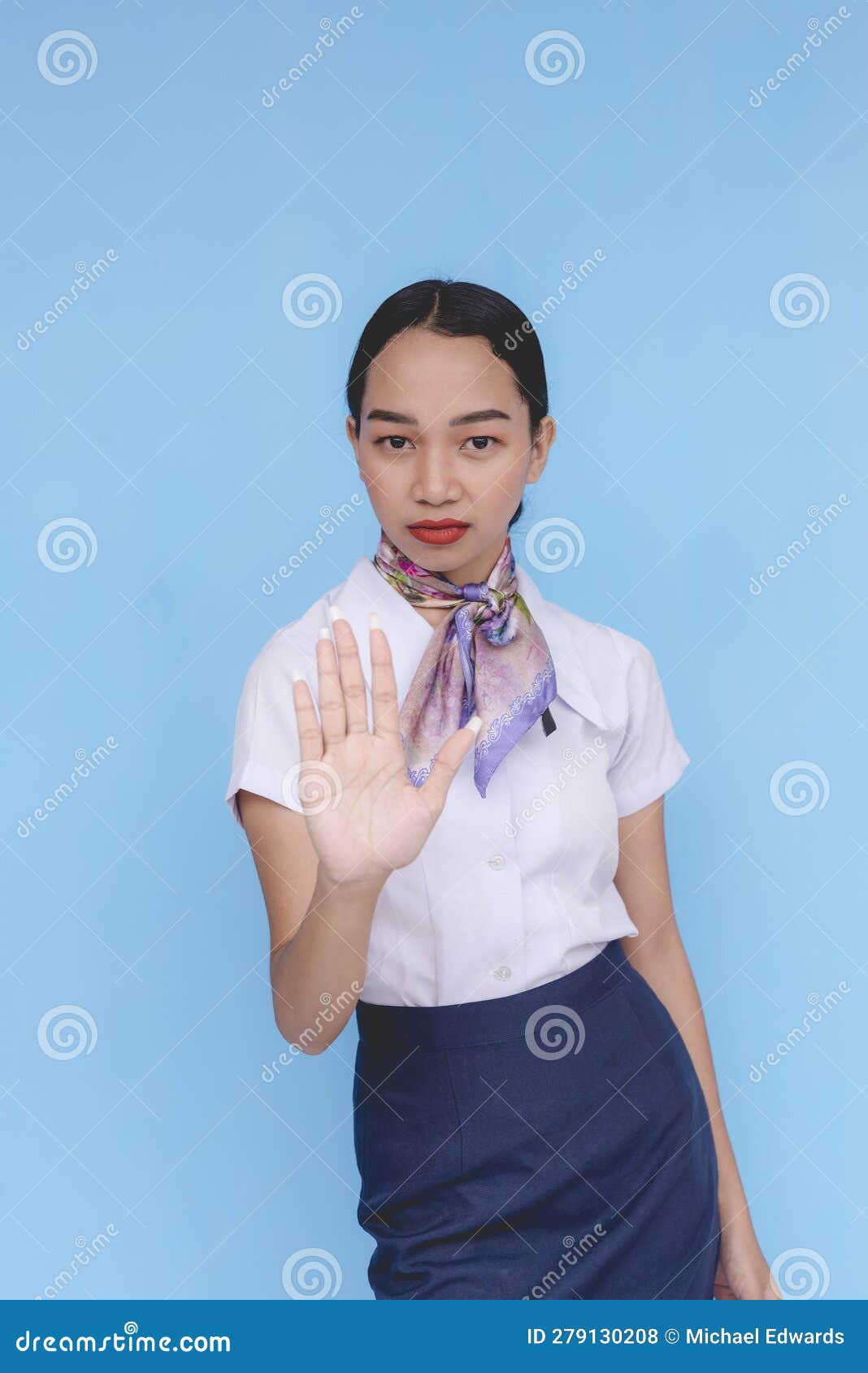 A Flight Attendant Telling a Passenger To Stop. a Stewardess with Her ...
