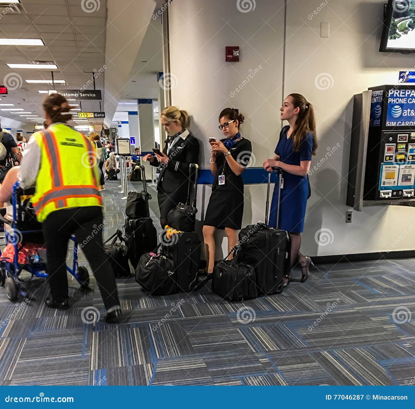 Flight Attendants Check Email in Airport Editorial Photography - Image ...