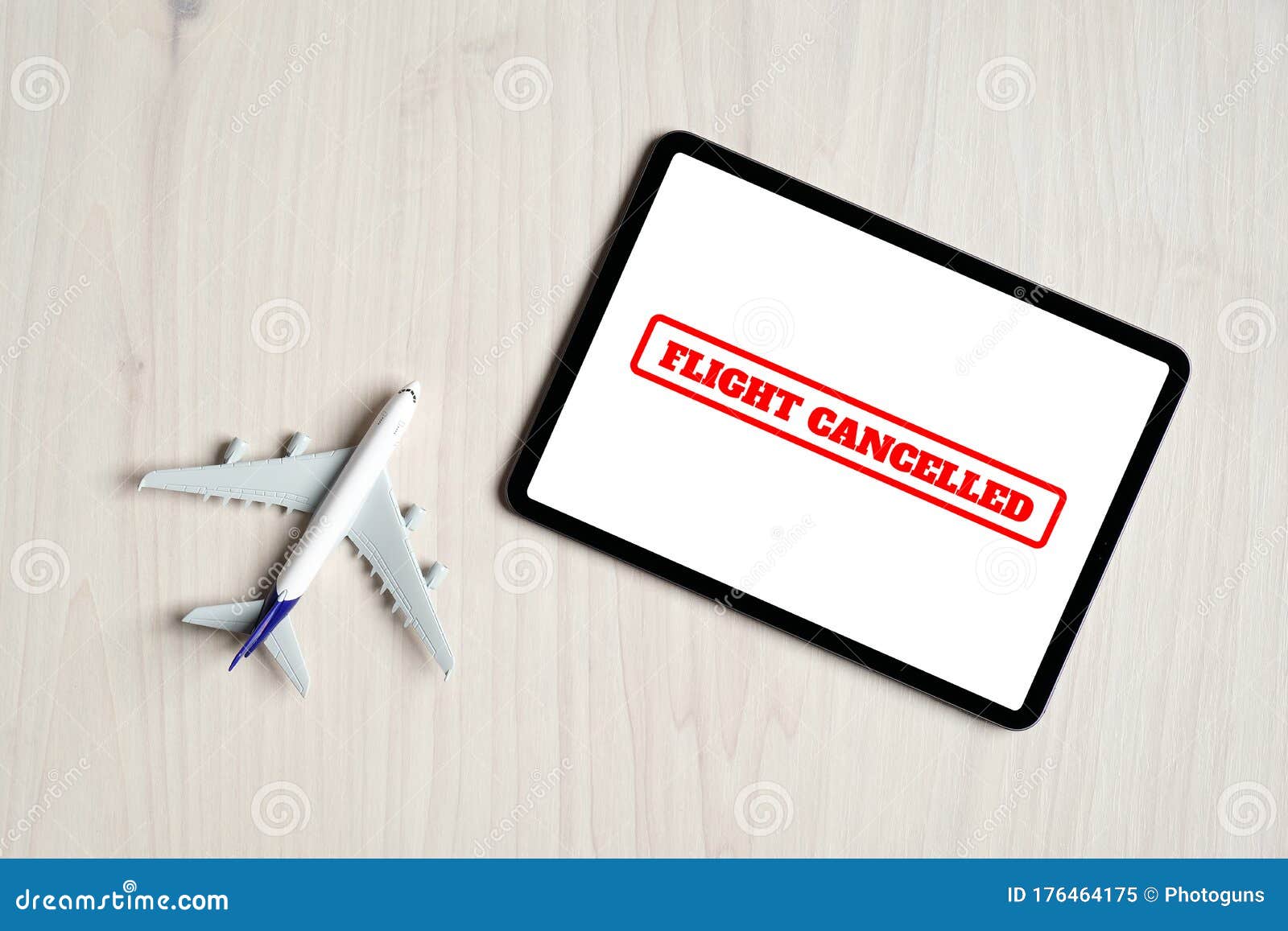 Flight Cancellations Concept. Top View Airplane Toy and Digital Tablet ...
