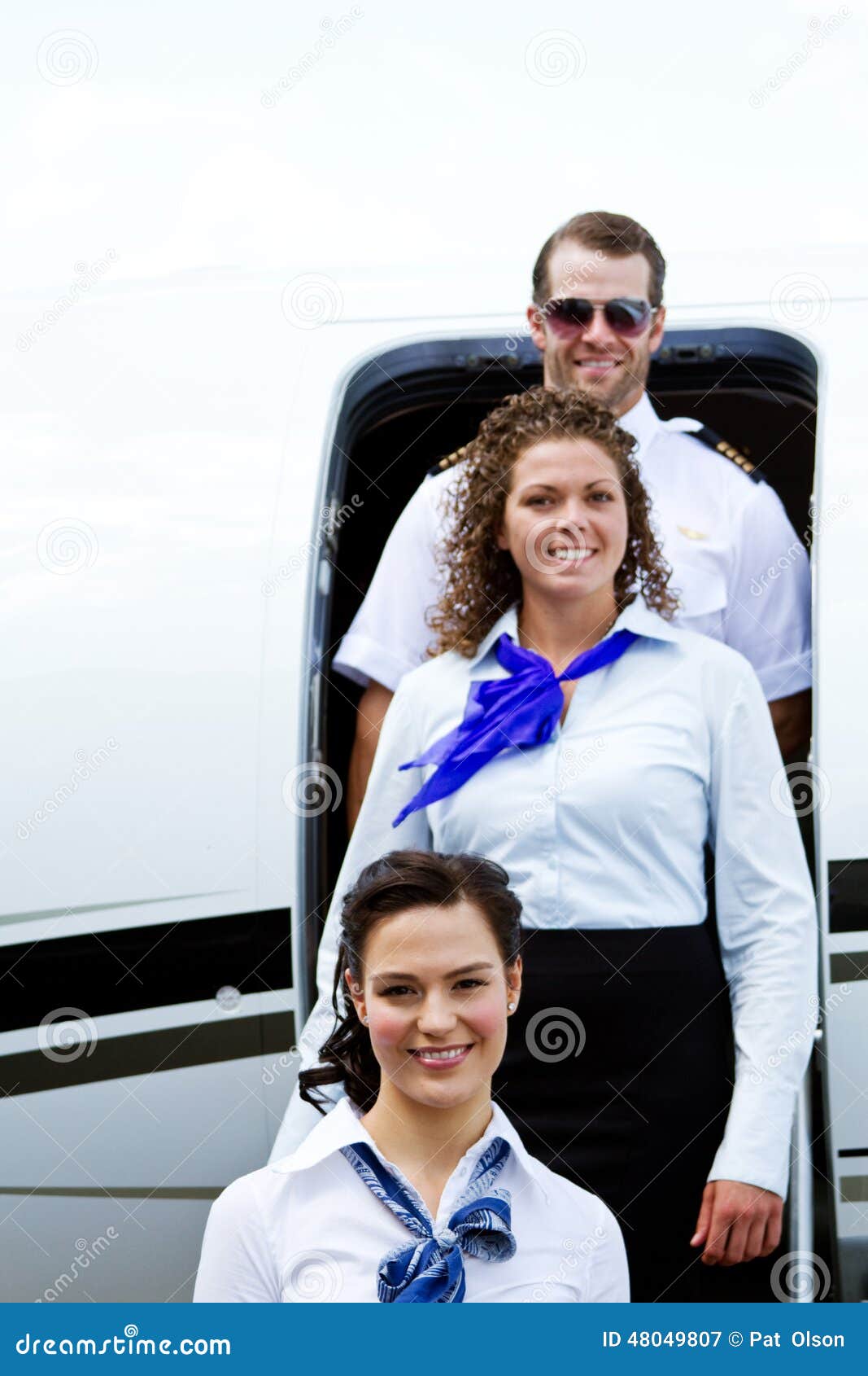 Flight crew exiting plane stock image. Image of friendly - 48049807