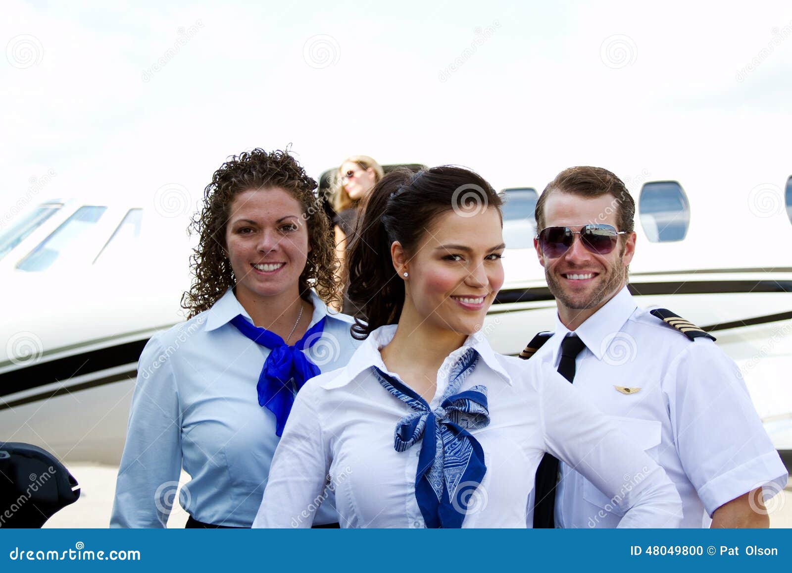 Flight Crew in Front of Plane Stock Photo - Image of girl, person: 48049800