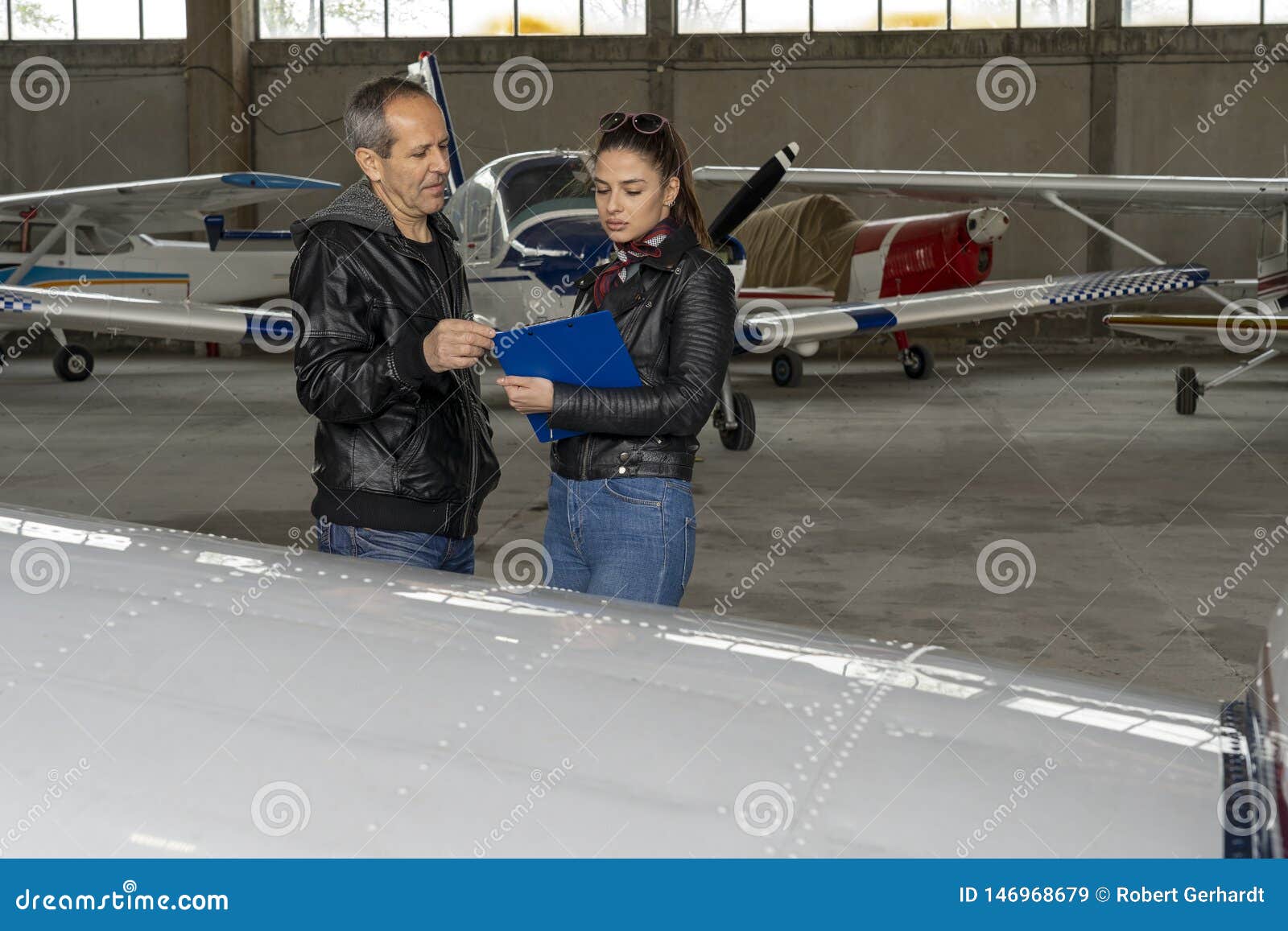 Student Pilot and Flight Instructor Check an Aircraft for Safety in a ...