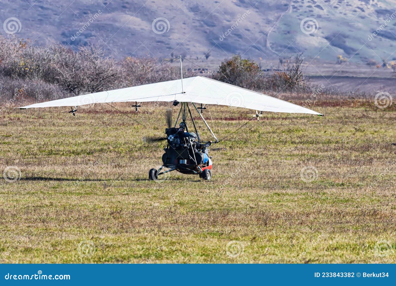 Flight on a Motorized Paraglider in Mountainous Terrain Editorial ...