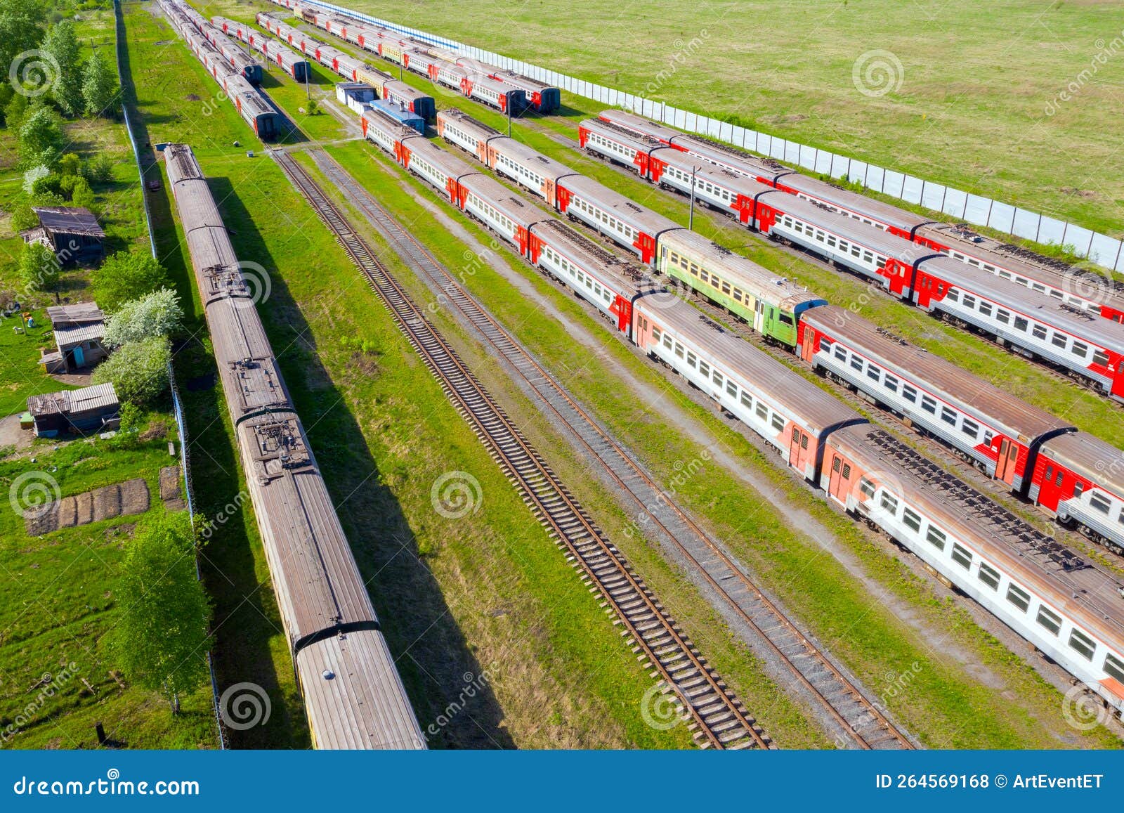 Flight Over Passenger Trains at Railway Station on a Summer Day Stock ...